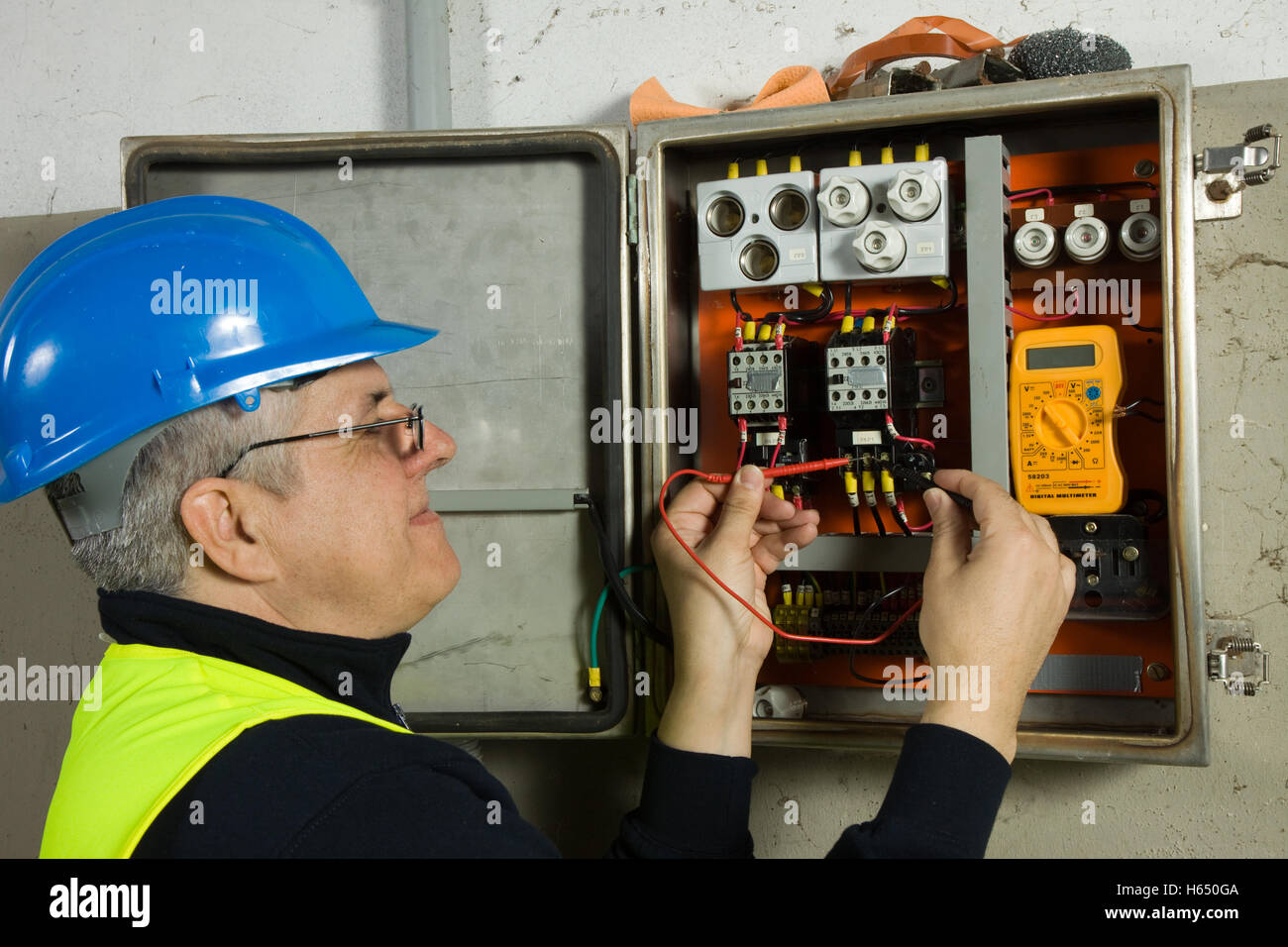 electrician at work with an electric plant Stock Photo - Alamy
