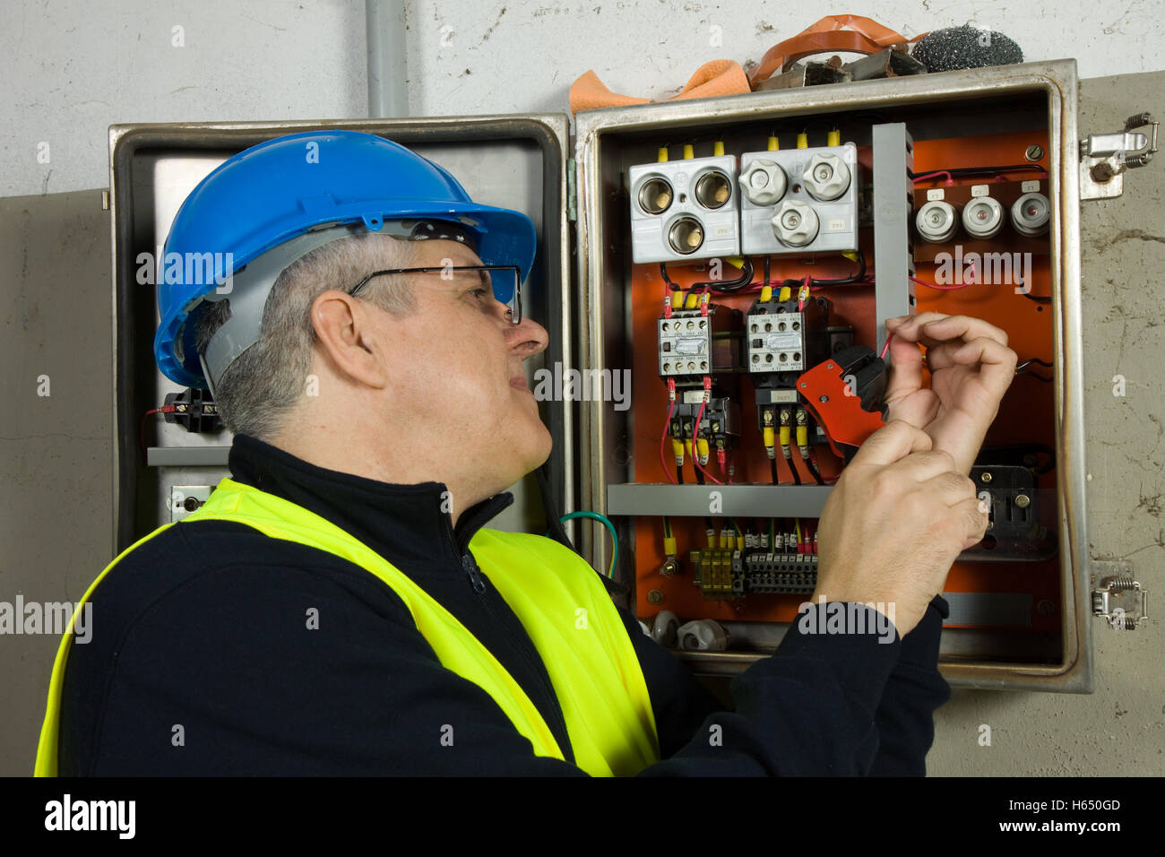 electrician at work with an electric plant Stock Photo - Alamy