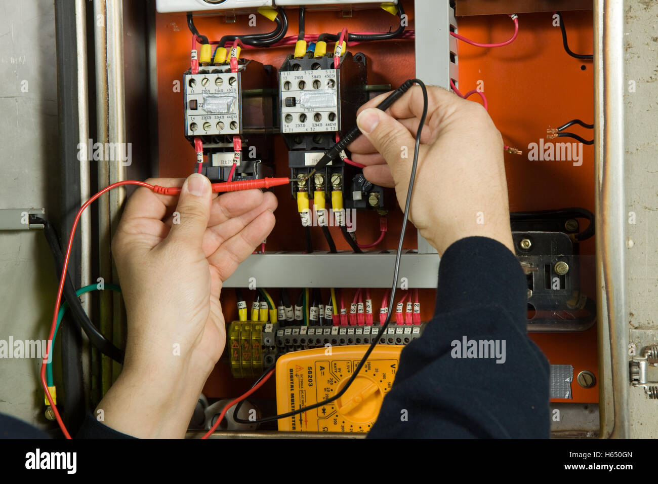 electrician at work with an electric plant Stock Photo - Alamy
