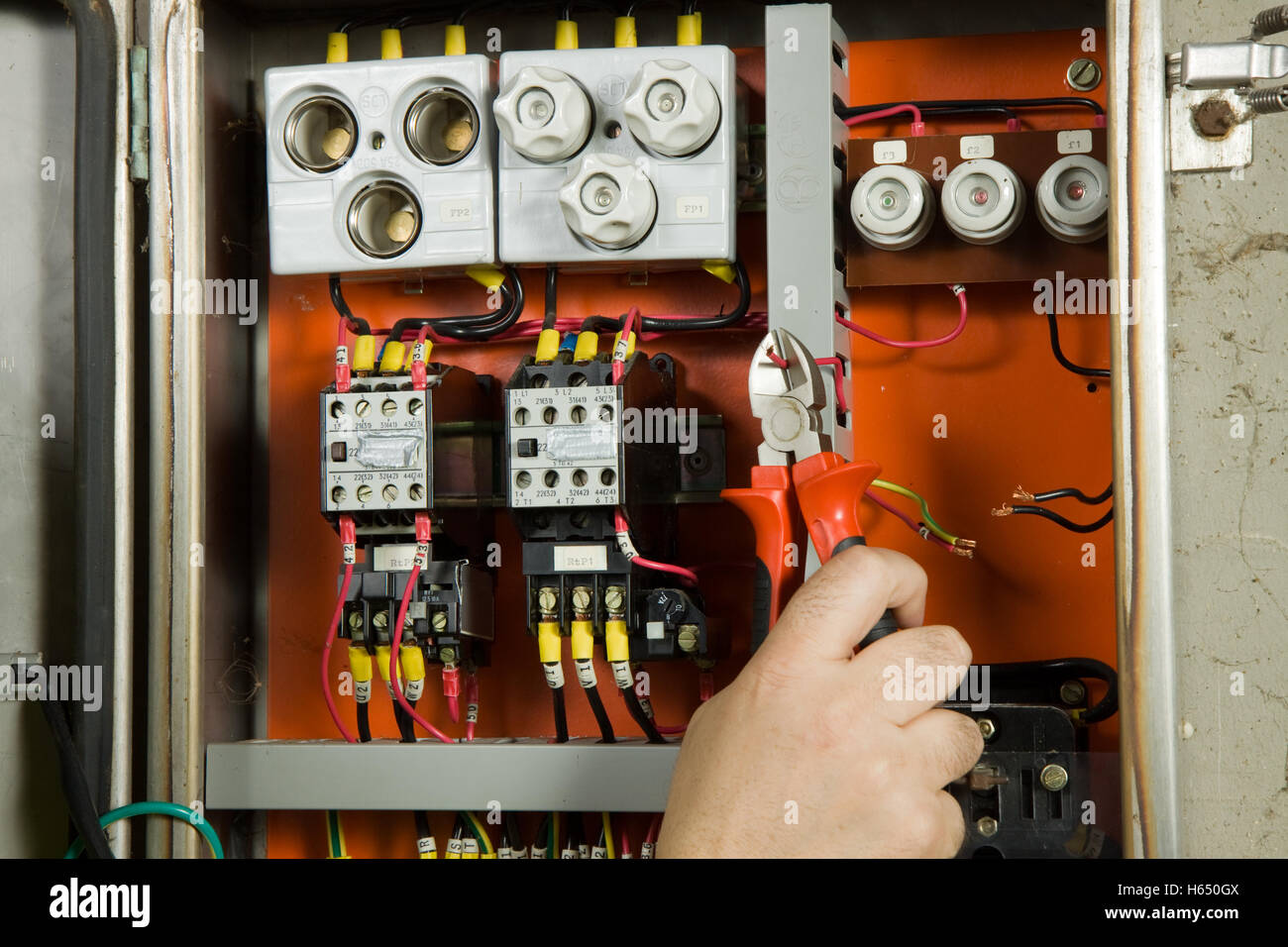 electrician at work with an electric plant Stock Photo - Alamy