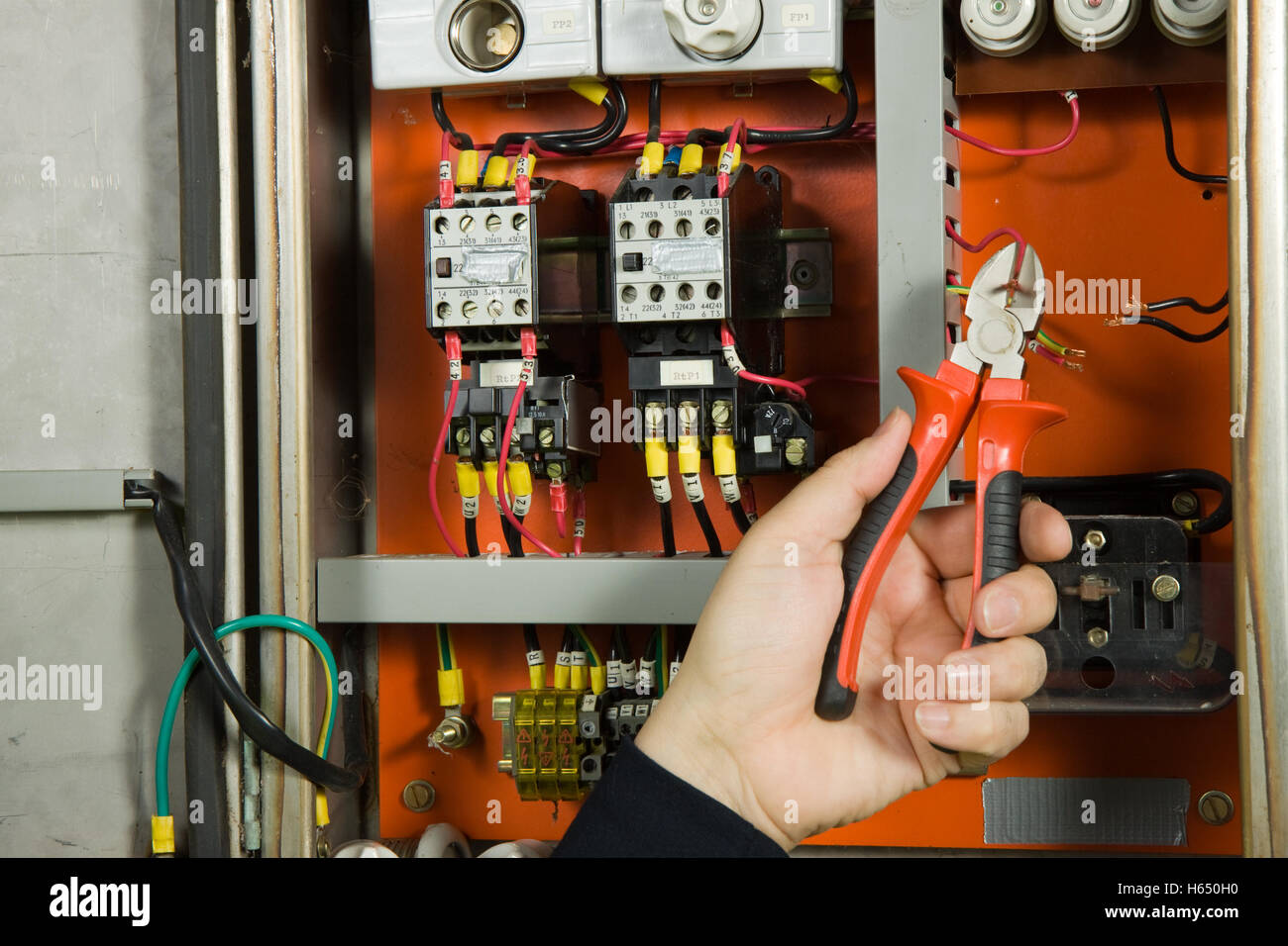 electrician at work with an electric plant Stock Photo - Alamy