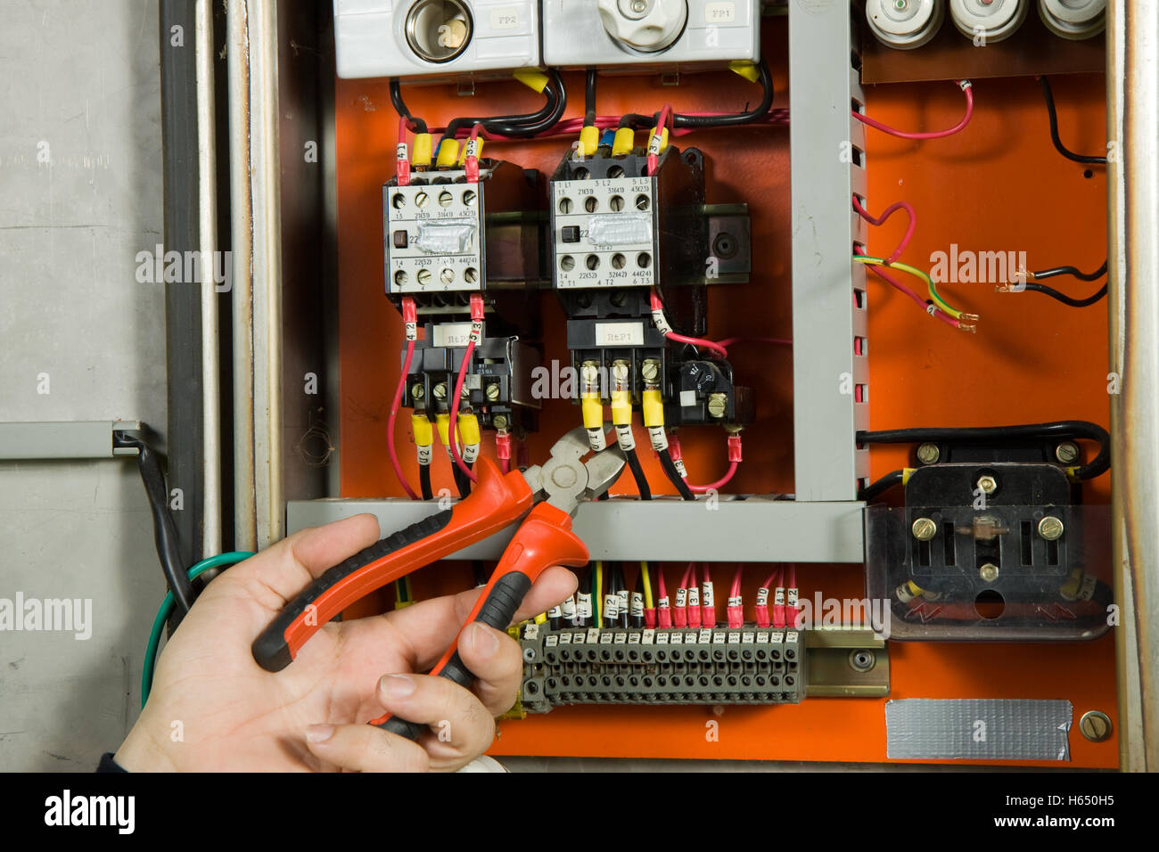 electrician at work with an electric plant Stock Photo - Alamy