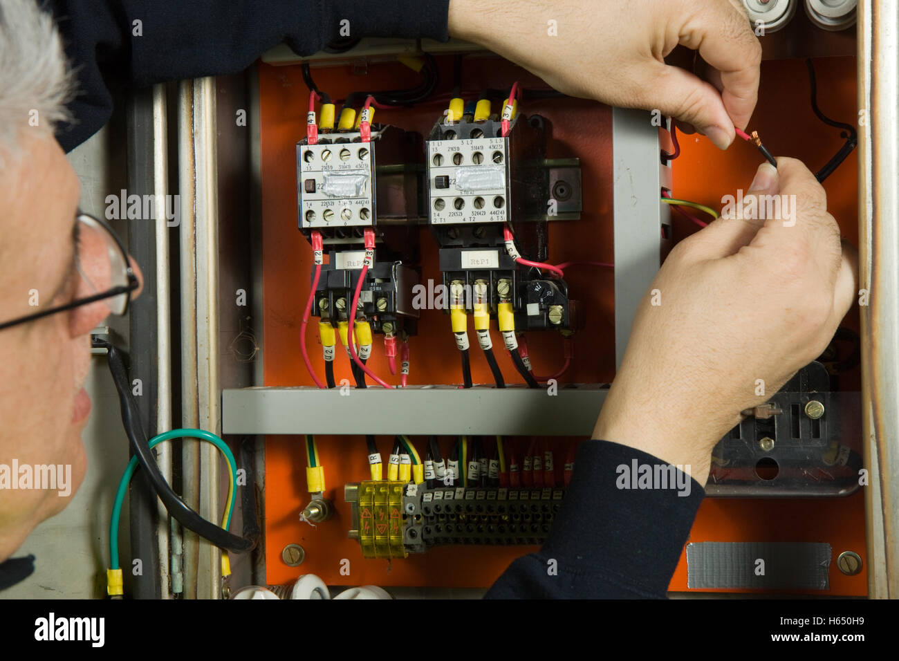 electrician at work with an electric plant Stock Photo - Alamy
