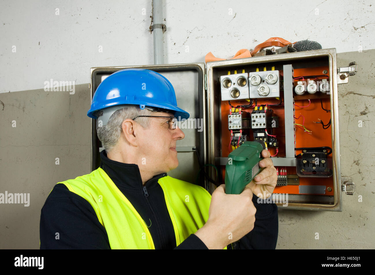 electrician at work with an electric plant Stock Photo - Alamy