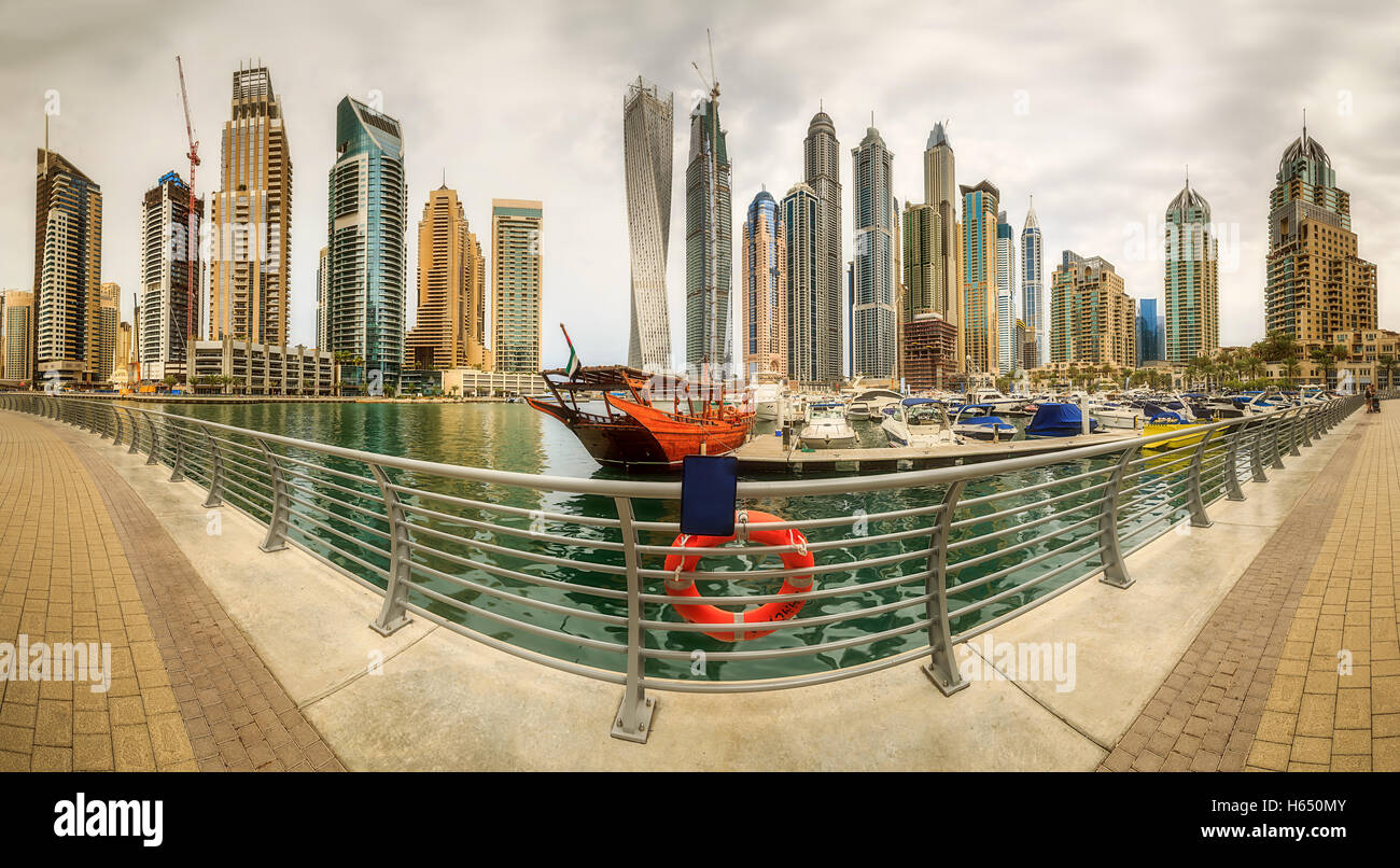 Panoramic view of Dubai Marina bay with yacht and cloudy sky, Dubai ...