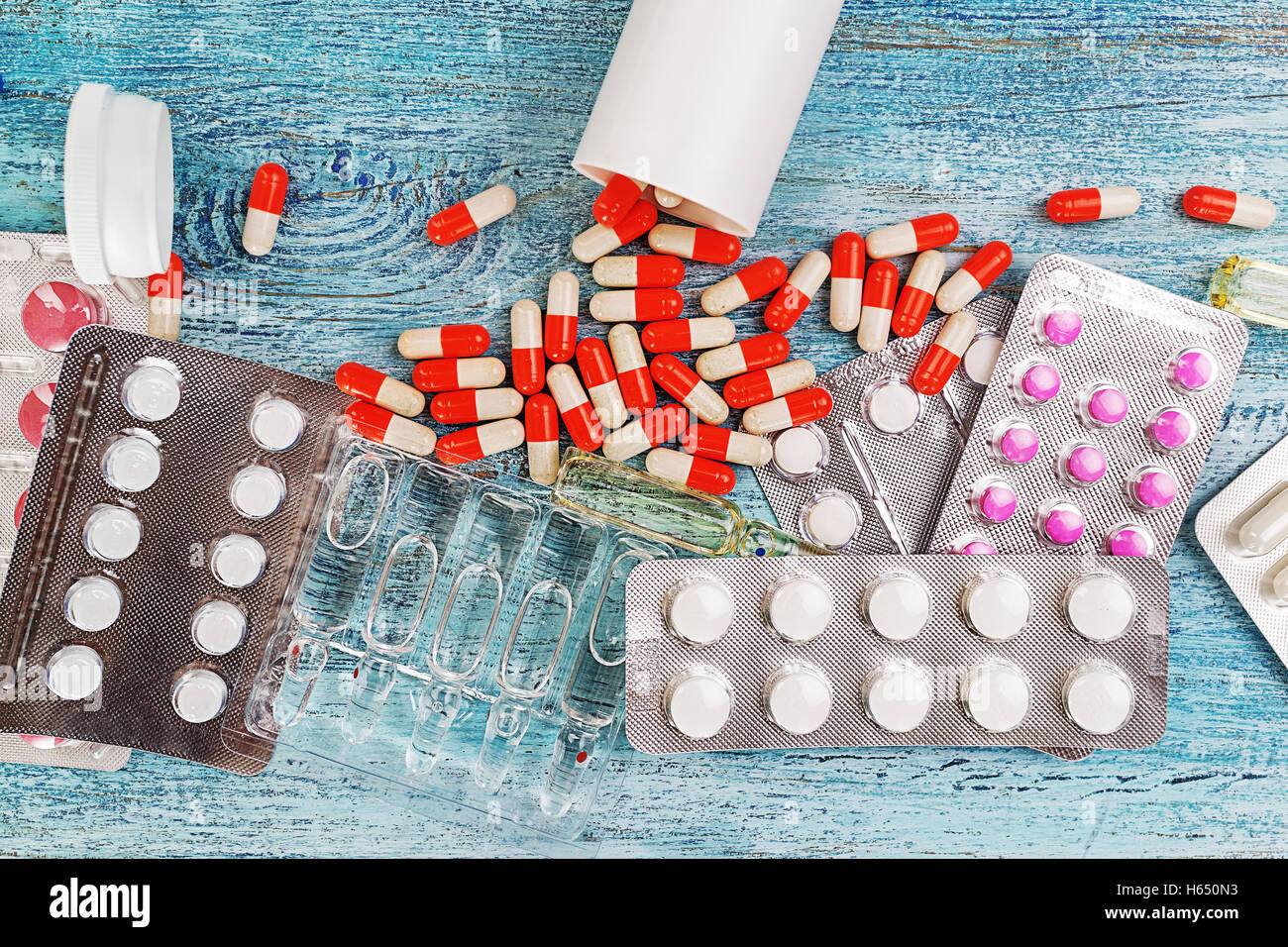 Drug ampules prescription for treatment medication. Heap of red orange ...