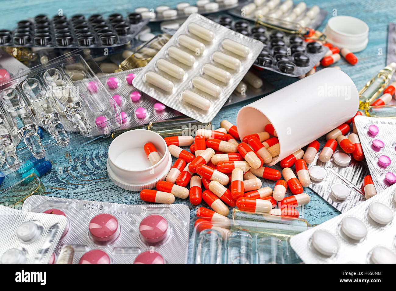 Drug ampules prescription for treatment medication. Heap of red orange ...