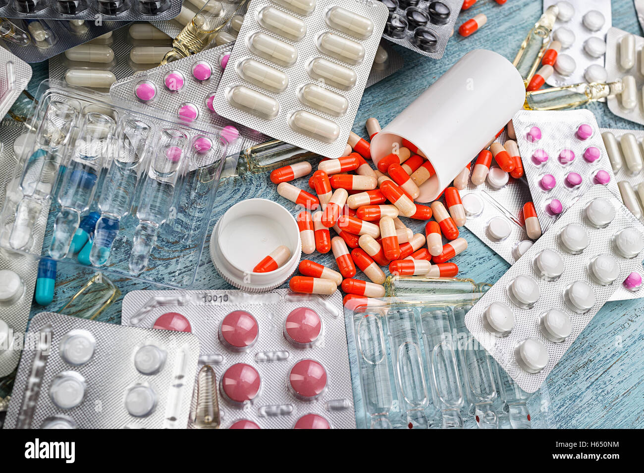 Drug ampules prescription for treatment medication. Heap of red orange ...