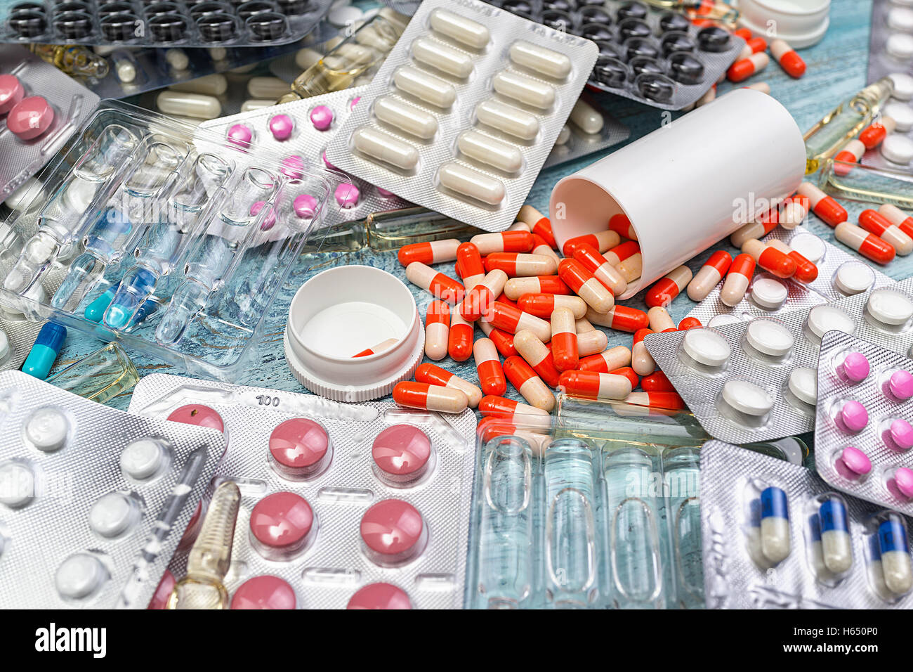 Drug ampules prescription for treatment medication. Heap of red orange ...