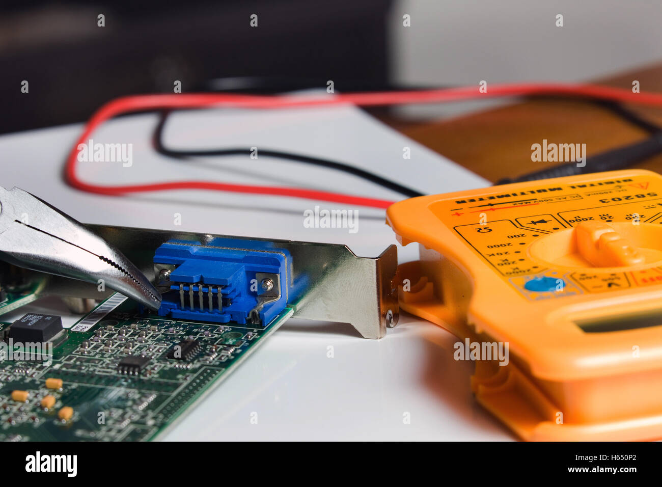 electrician at work with an electric appliance Stock Photo - Alamy