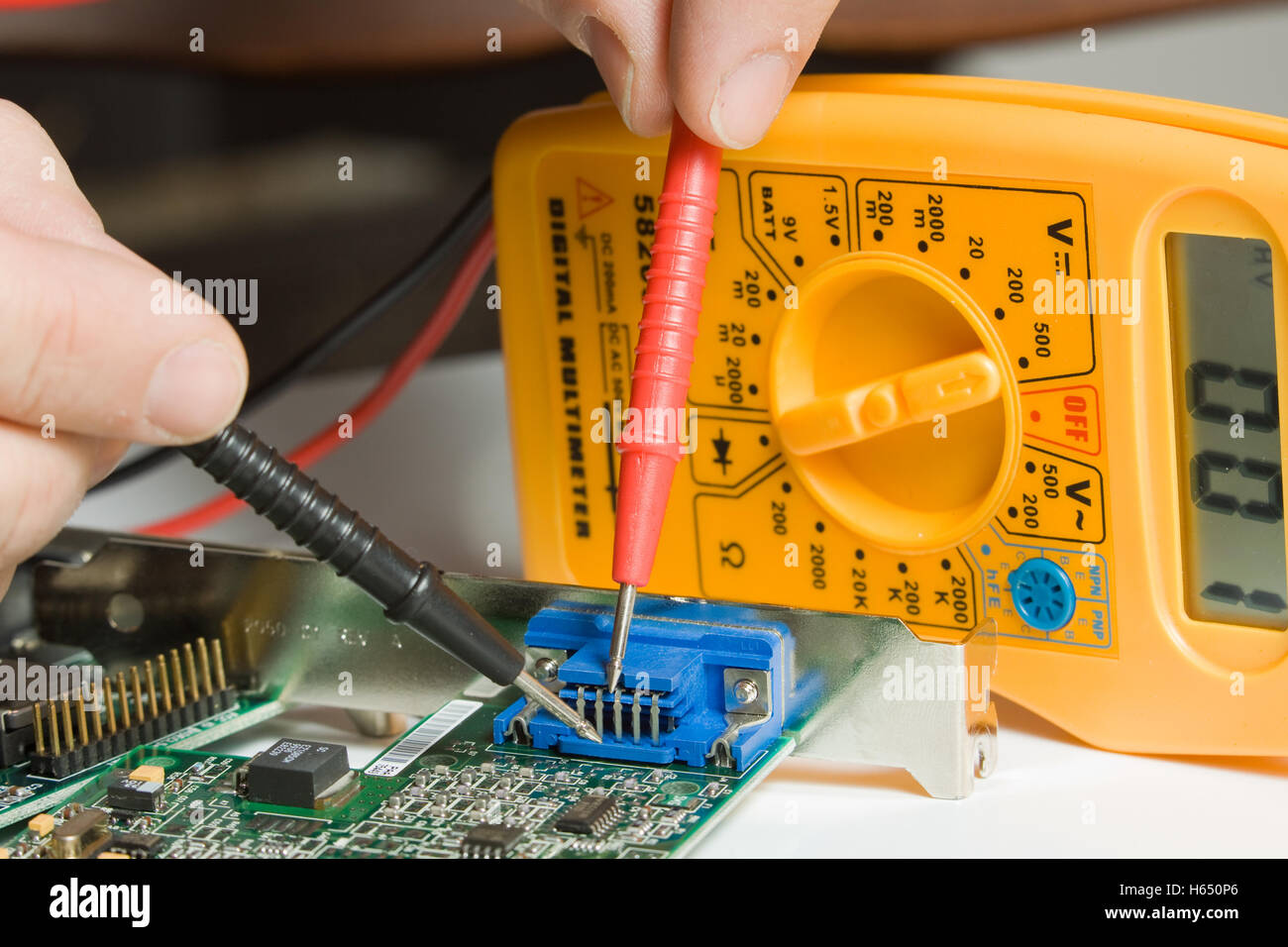 electrician at work with an electric appliance Stock Photo - Alamy