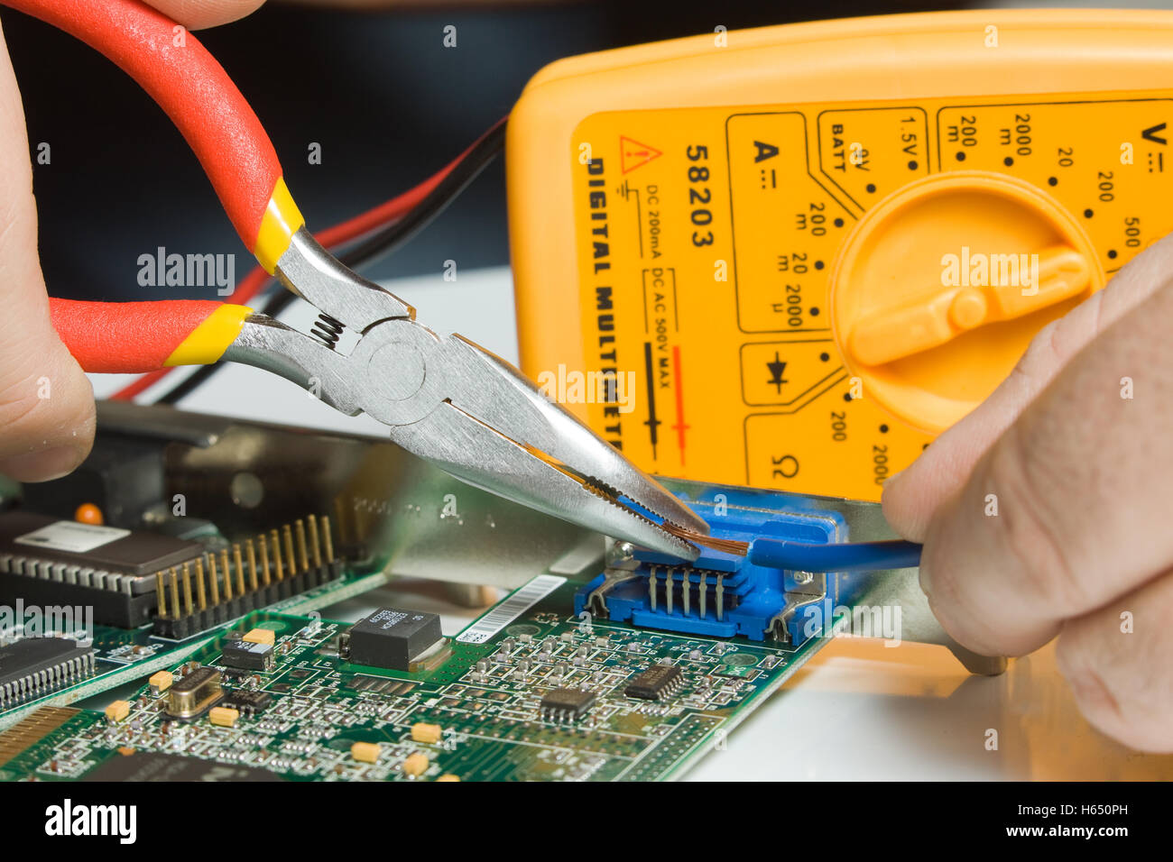 electrician at work with an electric appliance Stock Photo - Alamy