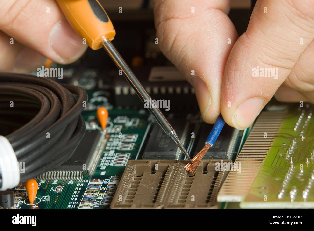 electrician at work with an electric appliance Stock Photo - Alamy