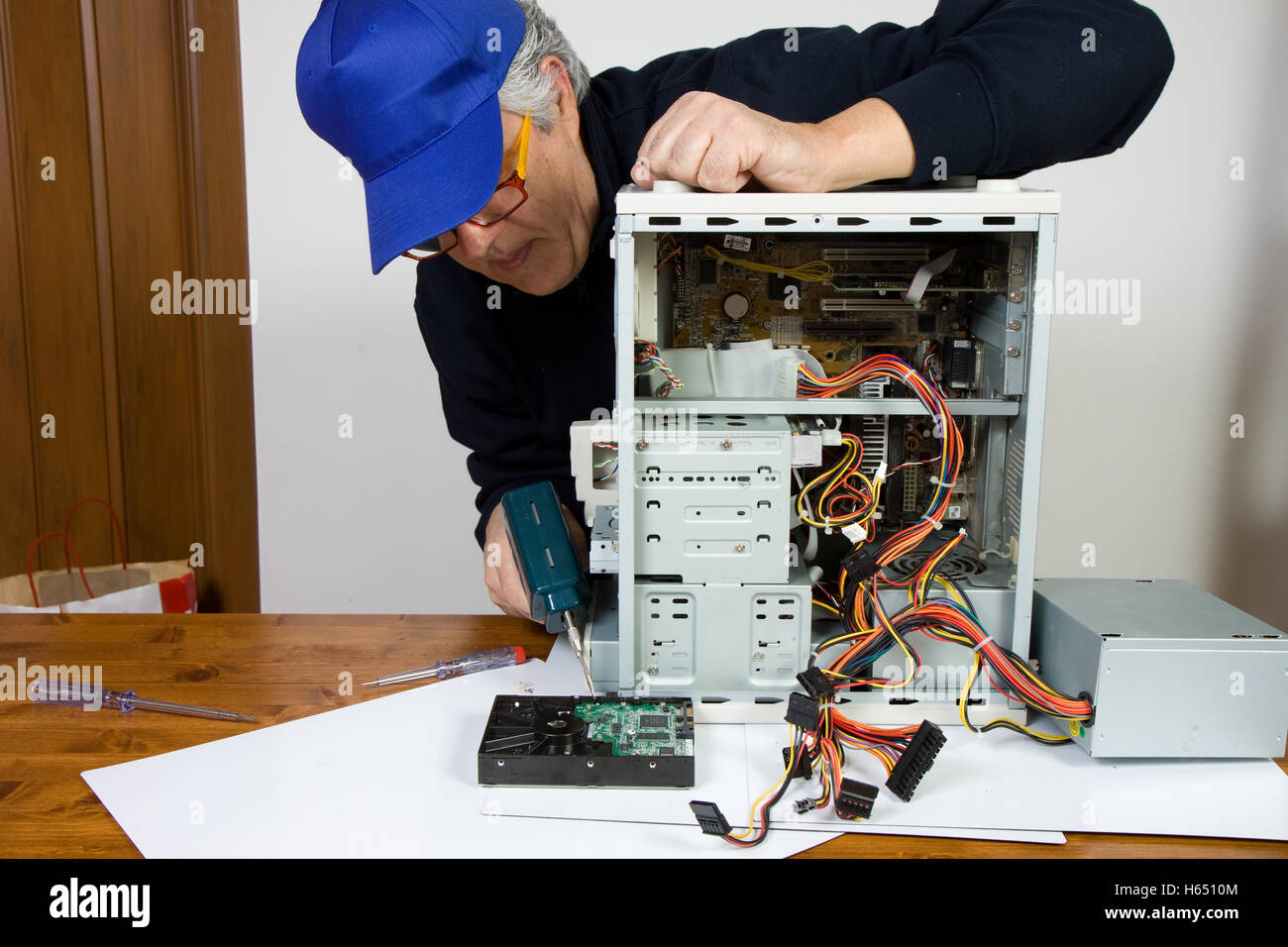 electrician at work with an electronic device Stock Photo - Alamy
