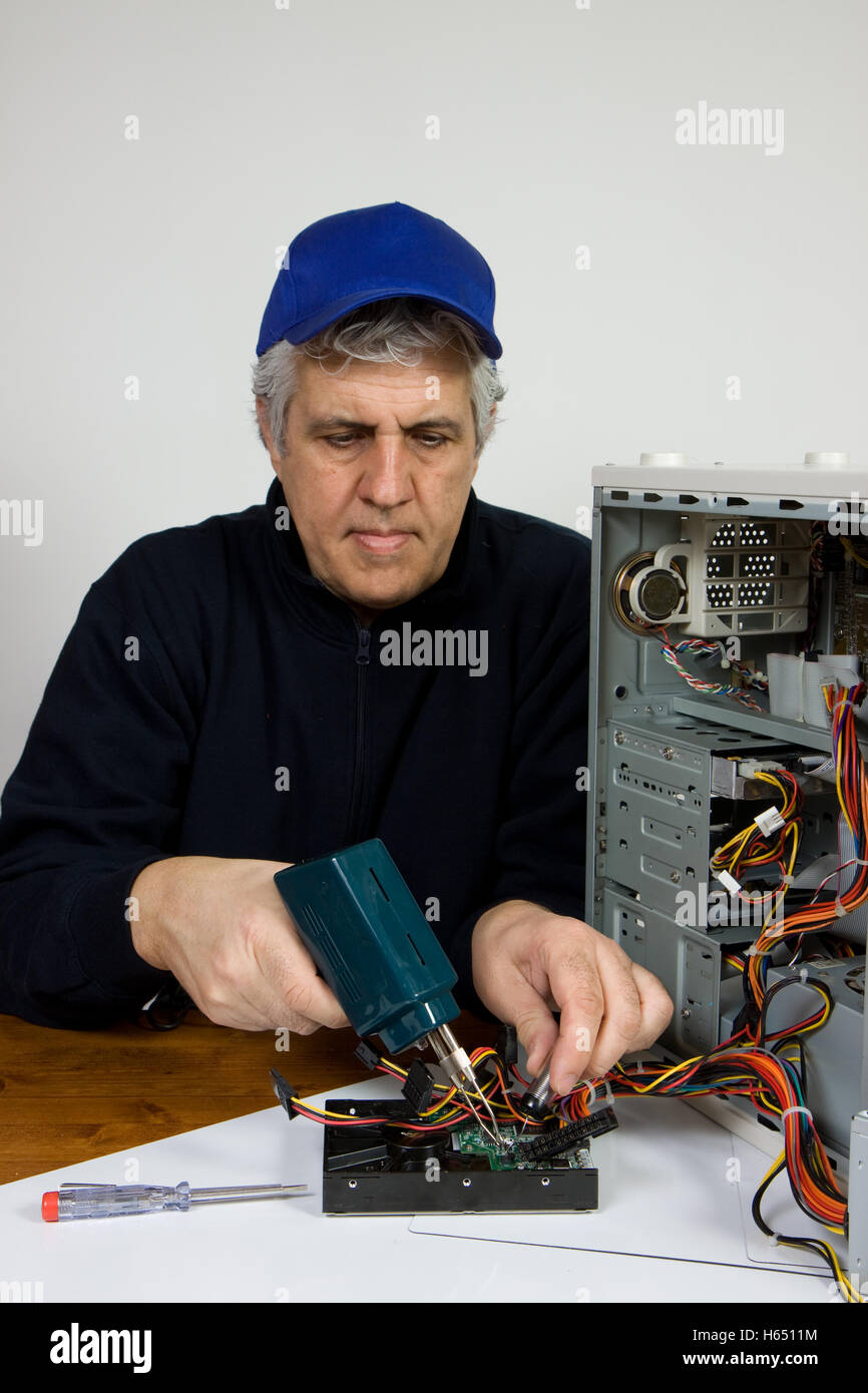 electrician at work with an electronic device Stock Photo - Alamy