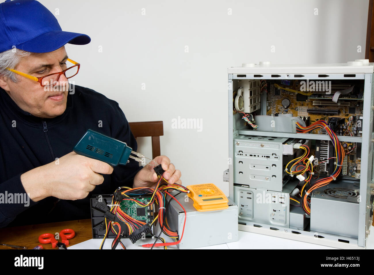 electrician at work with an electronic device Stock Photo - Alamy