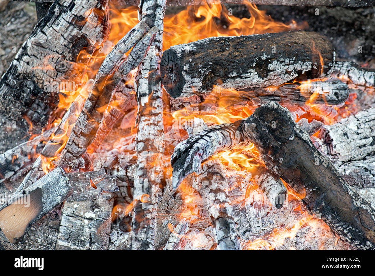 Closeup of warm glowing embers in fireplace; white and gray ash Stock ...