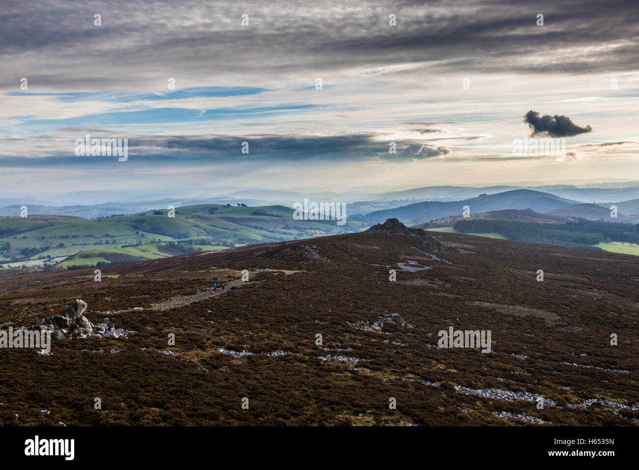 Walkers on the quartzite ridge path of the Stiperstones, Shropshire ...