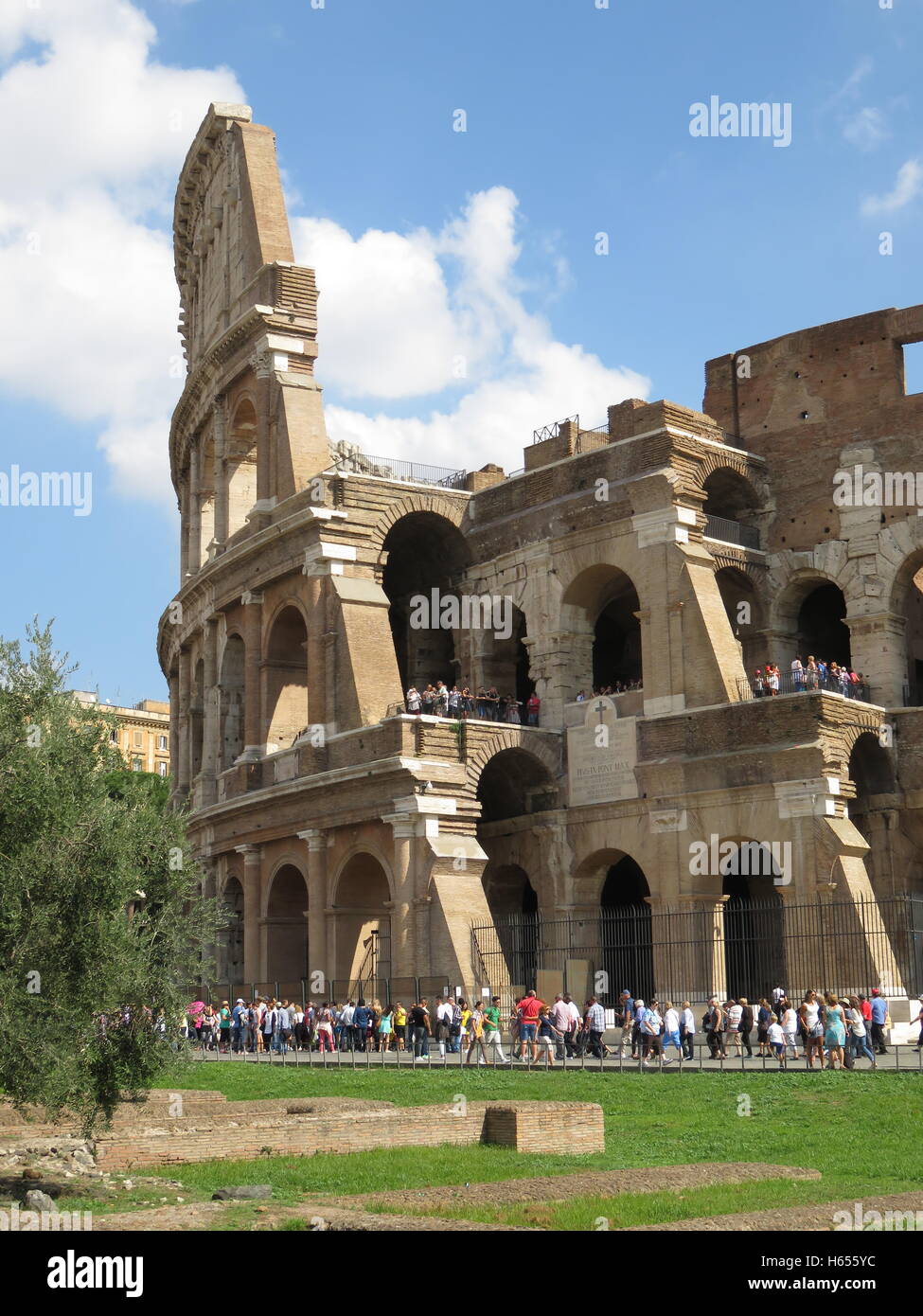 Exterior view of the Colosseum with tourists Stock Photo - Alamy