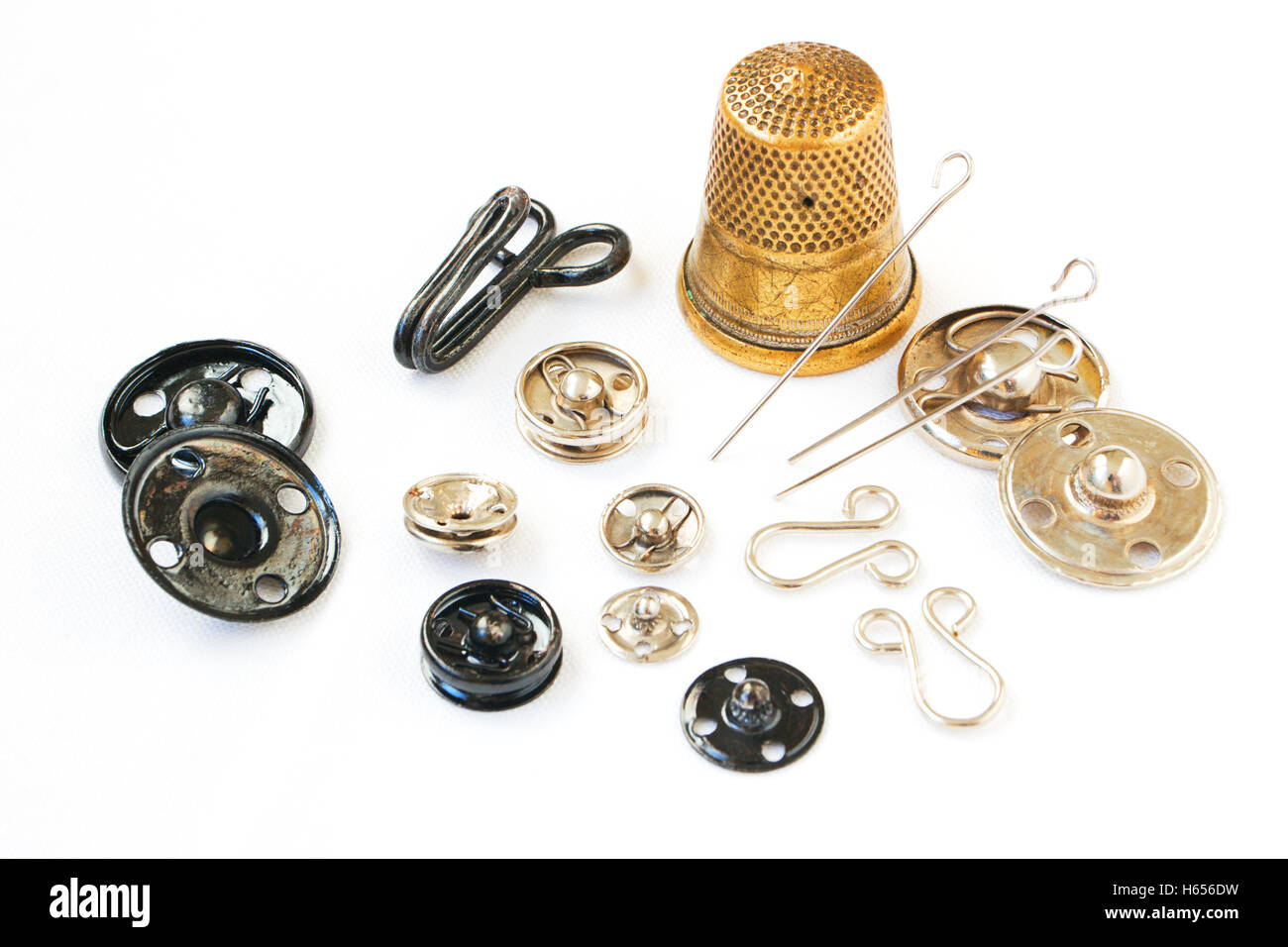 Vintage snap fasteners and bronze thimble Stock Photo - Alamy