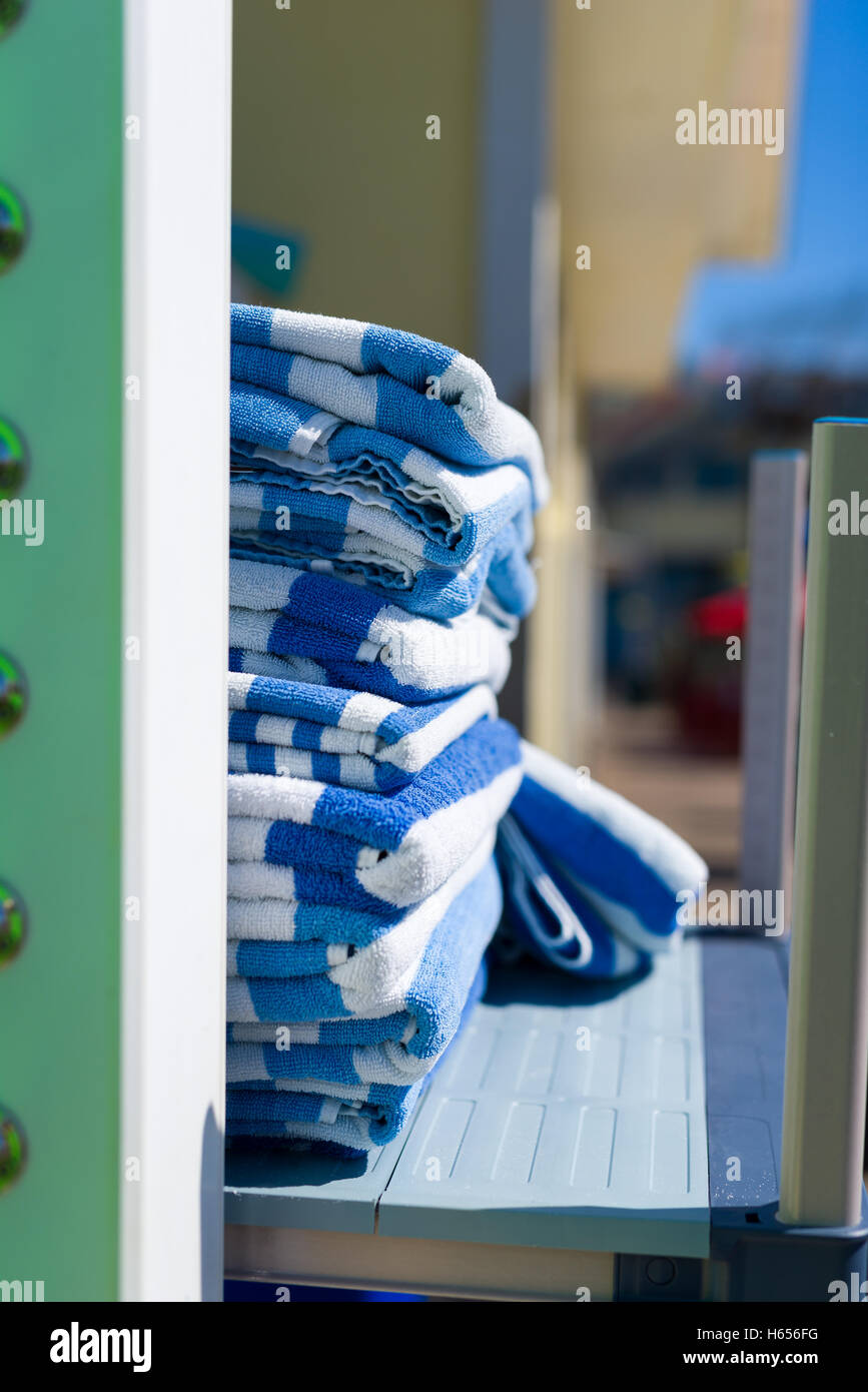 Stack of blue and white beach towels at a coastal resort Stock Photo ...