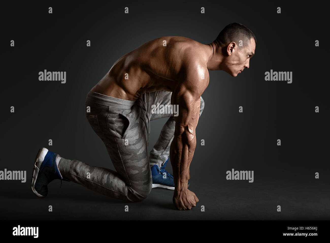 Muscled male model showing his back Stock Photo - Alamy