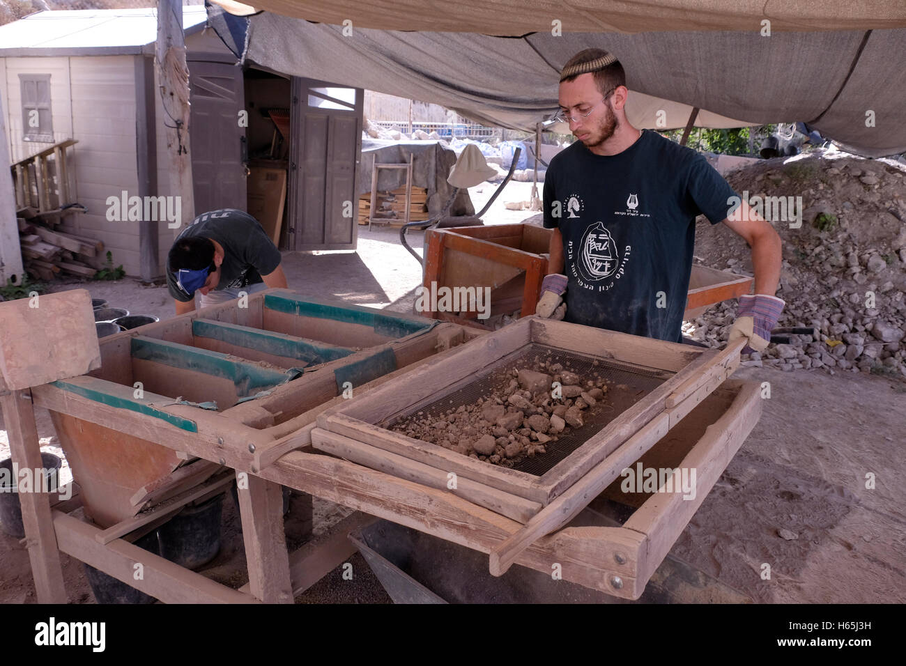 A Religious Jewish volunteer sorting through debris that was removed ...