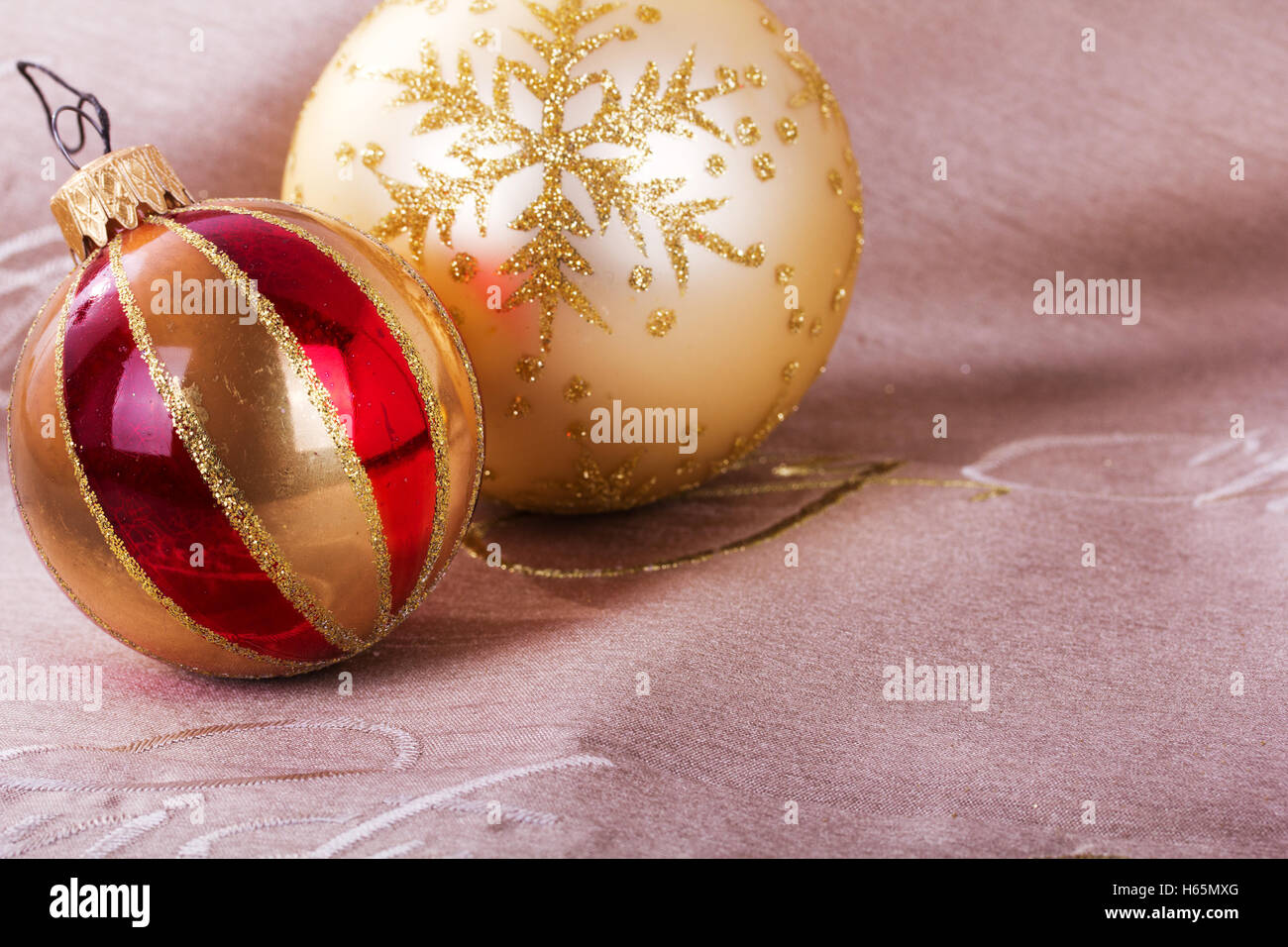 Festive gold Christmas decorations on a fabric background Stock Photo ...