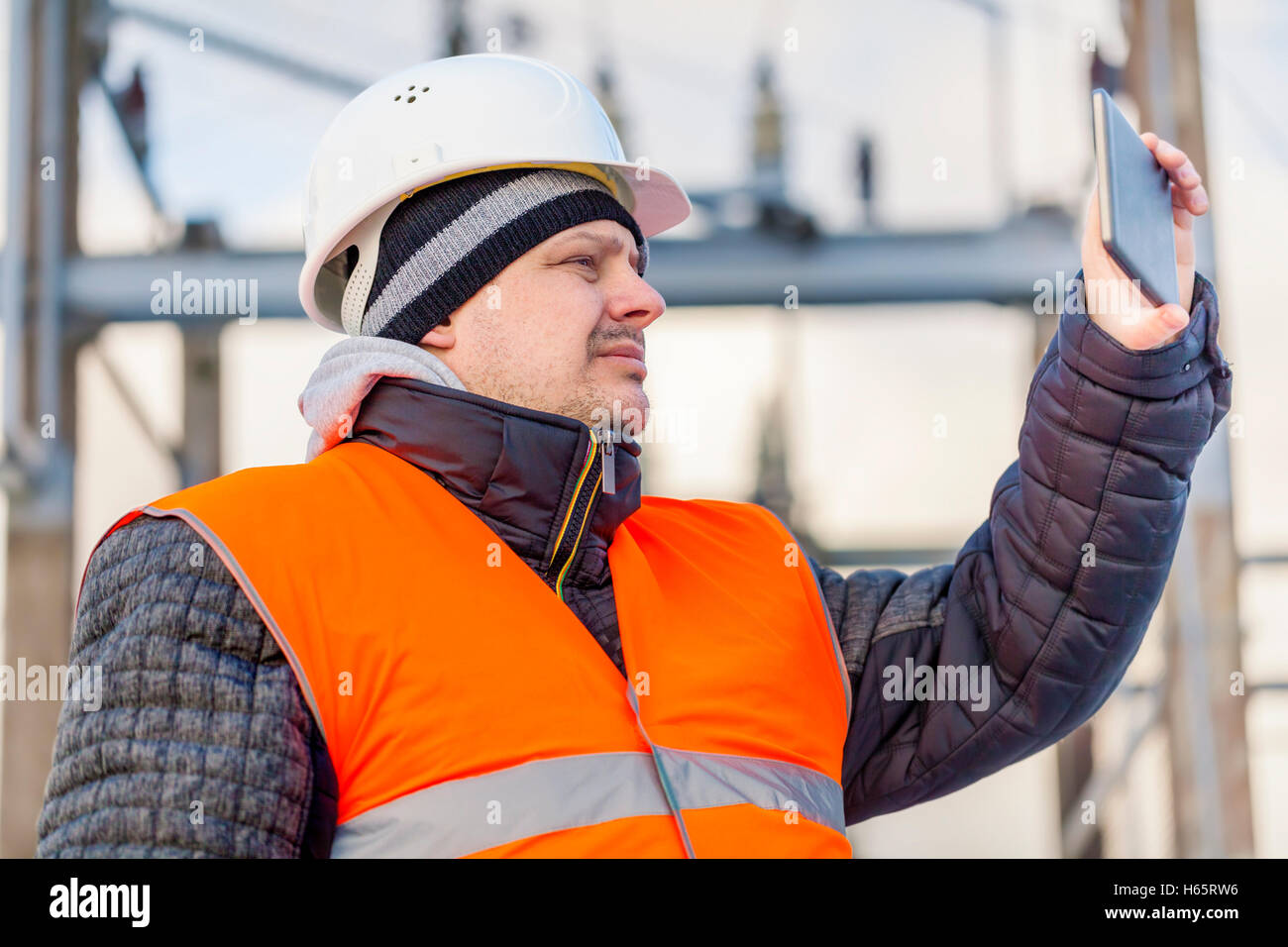 Electrical Engineer with tablet PC n electrical substation Stock Photo ...