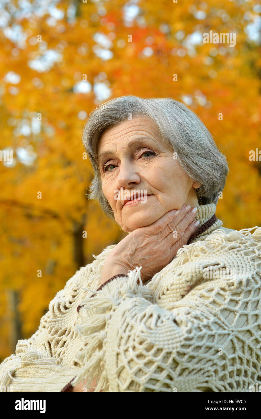 Senior woman walking Stock Photo - Alamy