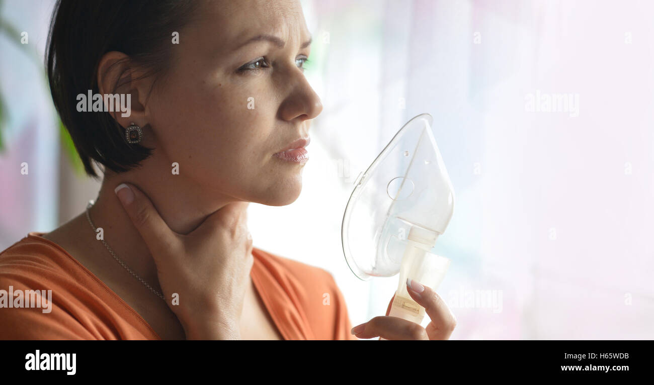 Young woman doing inhalation Stock Photo - Alamy