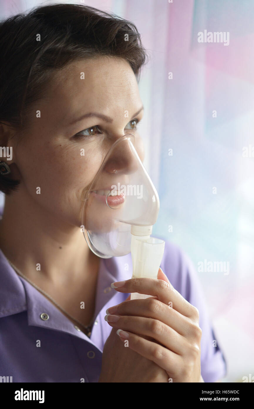 Young woman doing inhalation Stock Photo - Alamy