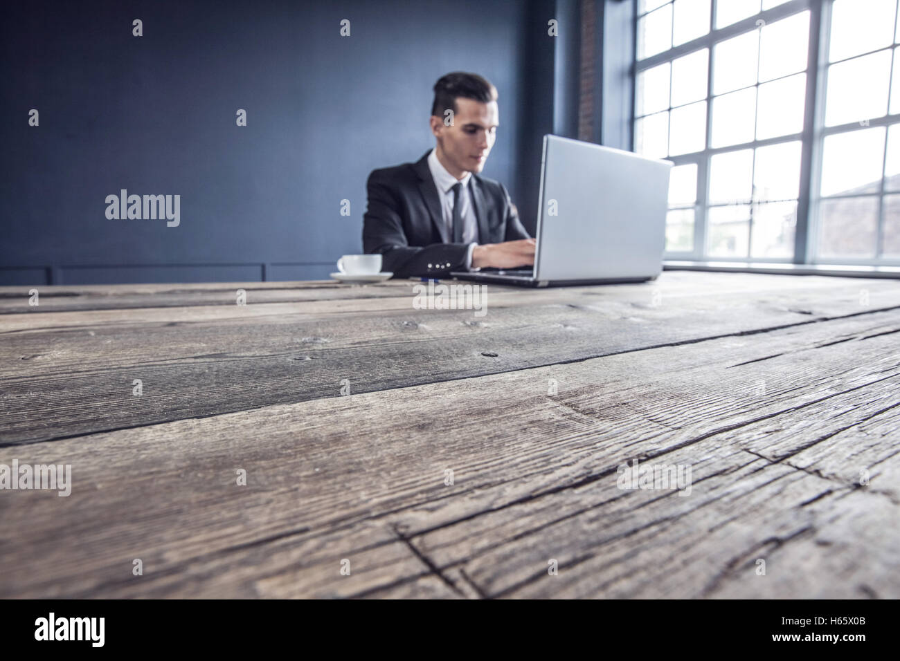 Business man working with laptop computer in office Stock Photo - Alamy