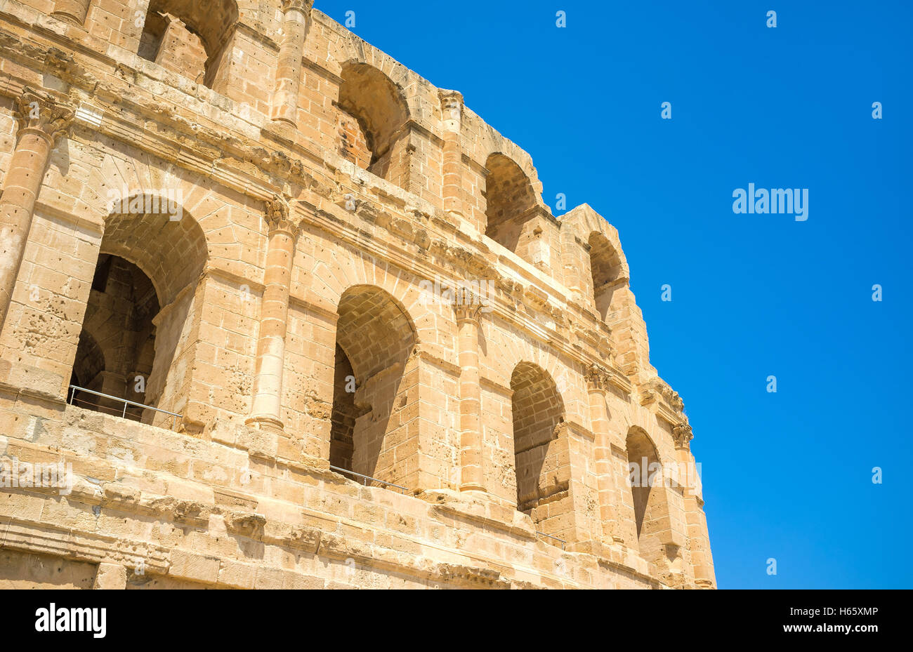 The ancient wall of amphitheatre with the numerous arches, El Jem ...