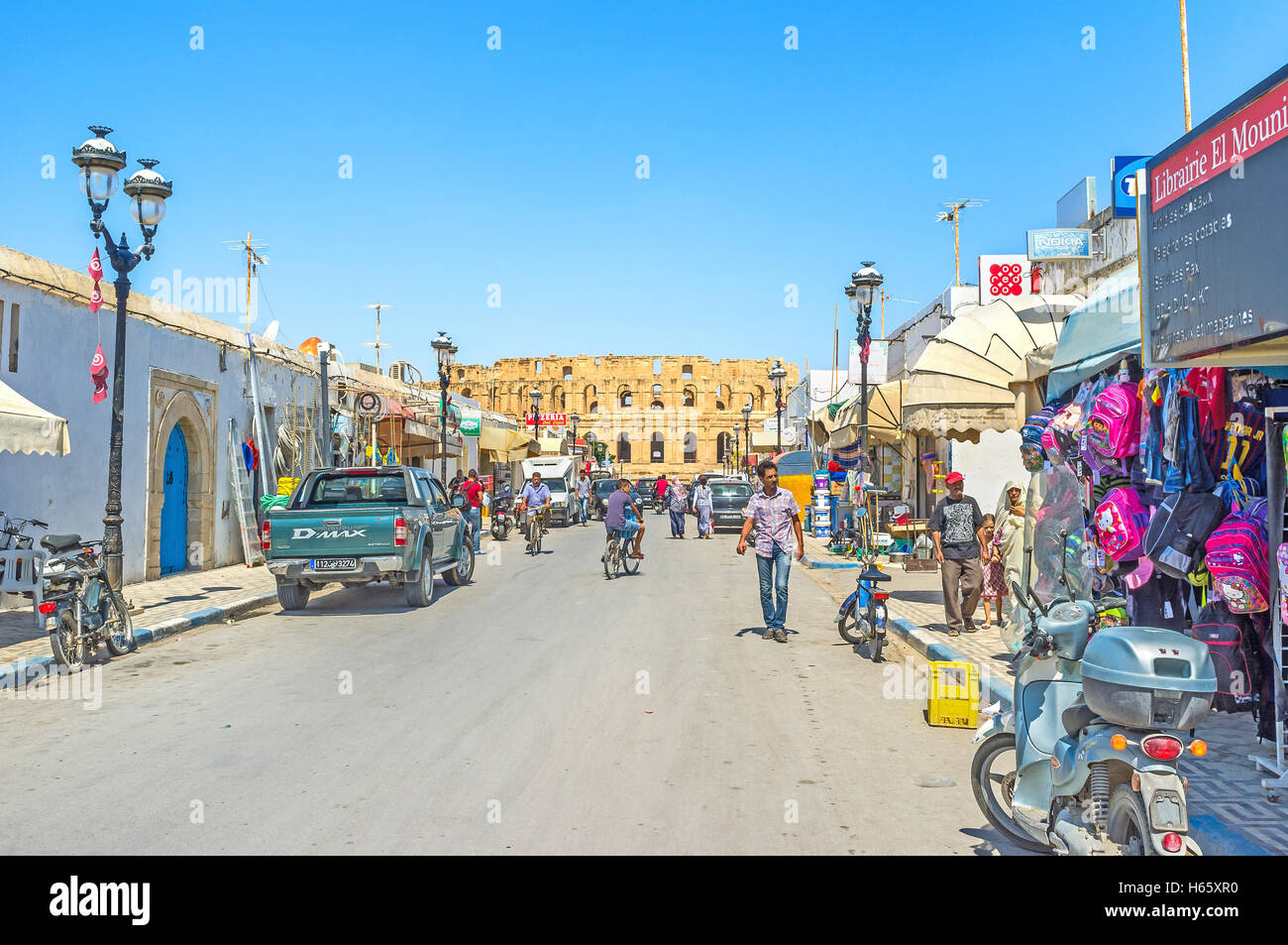 The shopping street of arabic town leads to the ancient roman arena, El ...