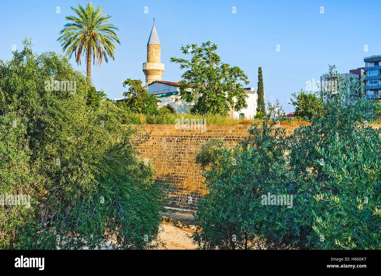 The minaret of the Bayraktar Mosque is seen from behind the Constanza Bastion, Nicosia, Cyprus ...