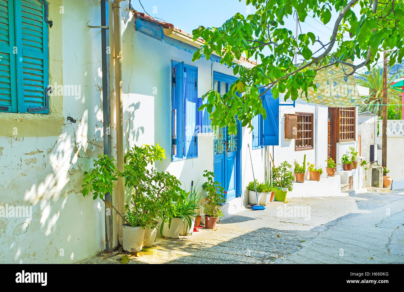 The flowers in pots are the traditional street decoration in Omodos ...