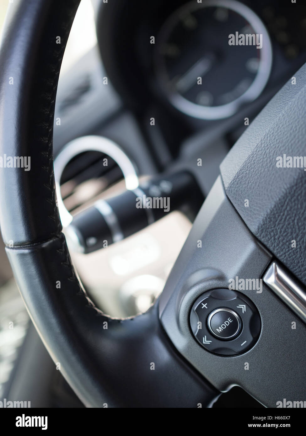 Steering wheel of the SUV with control buttons, shallow depth of field ...