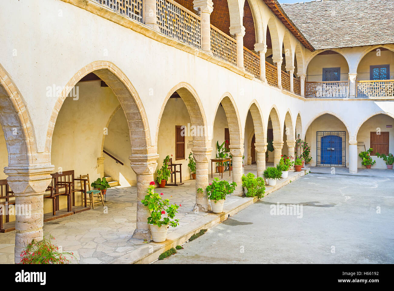 The stone arched gallery surrounds the Stavros monastery from all sides ...