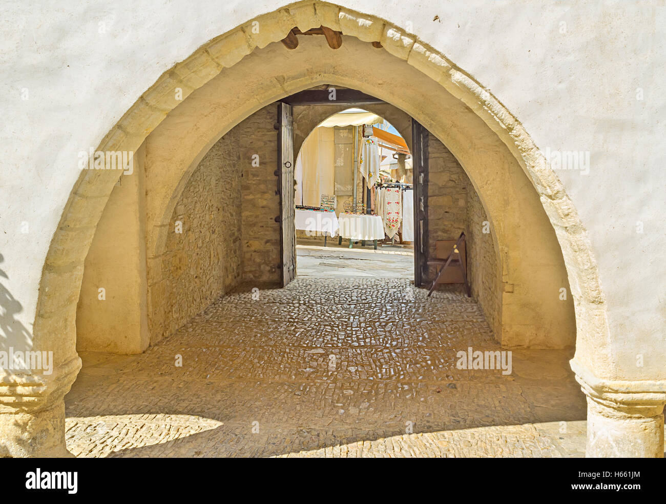 The view through the arch on the tourist street with many souvenir ...