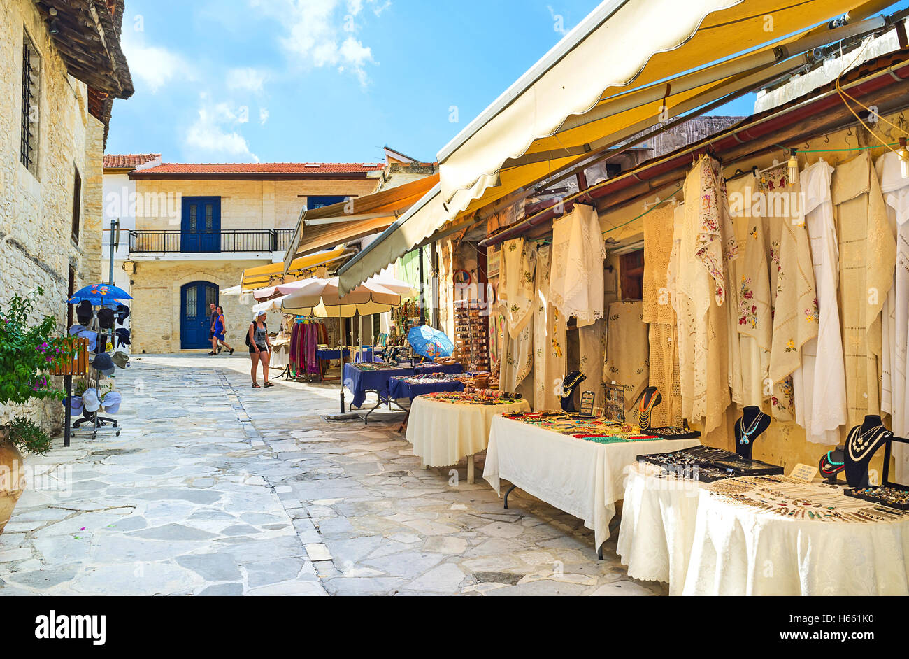 Numerous tourist stalls with lovely traditional tablecloths located ...