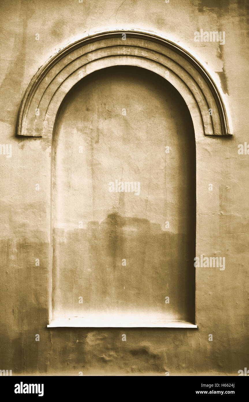 Old aged plastered faux arch false fake window stucco frame, vertical ...