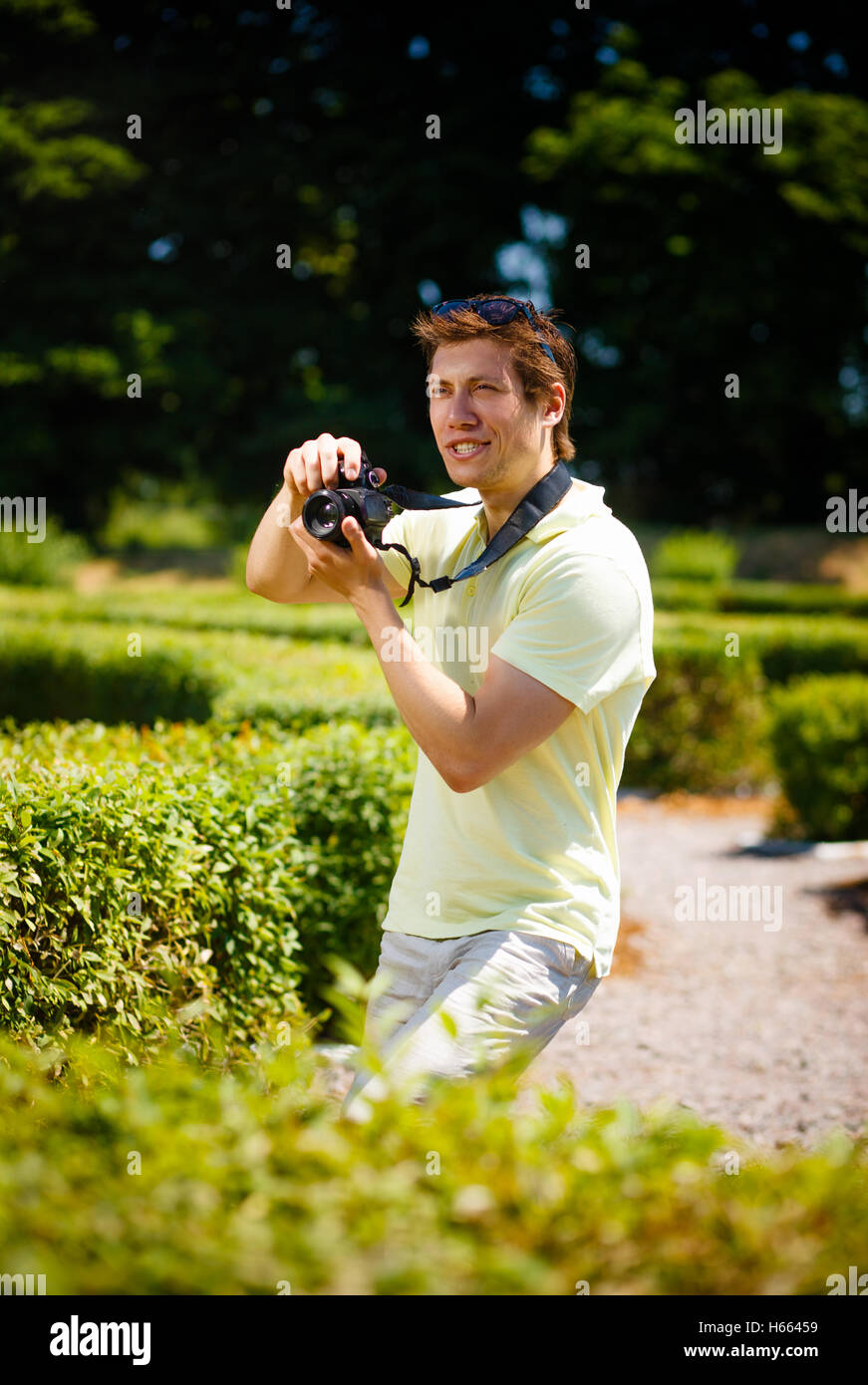 Photographer in park Stock Photo - Alamy