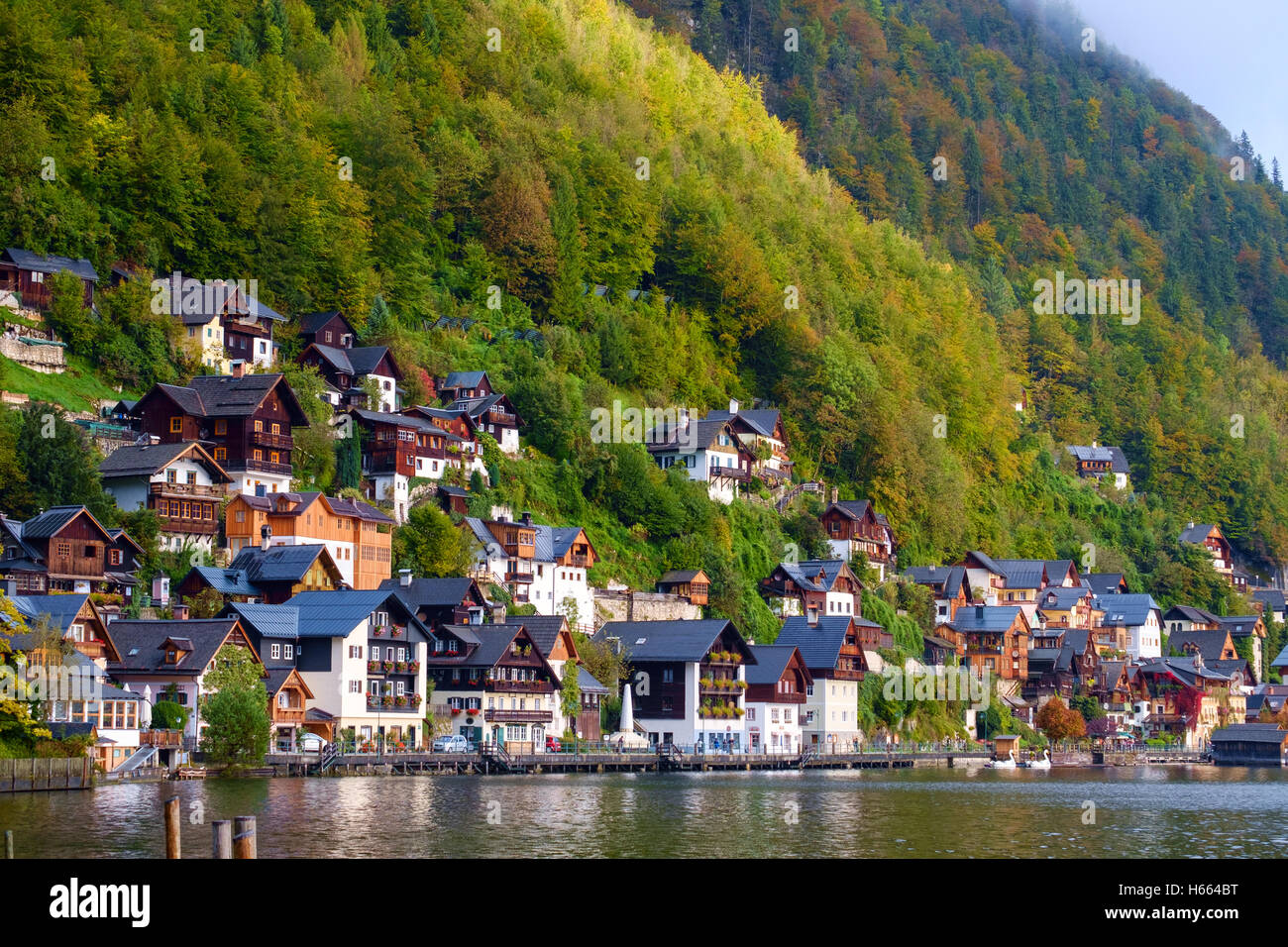 View of traditional old wooden houses up the hill in famous Hallstatt region of Salzkammergut ...