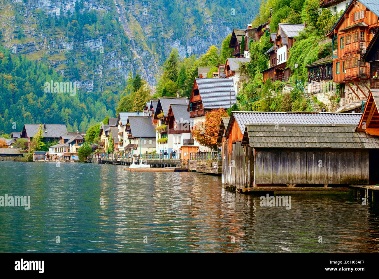View of traditional old wooden houses up the hill in famous Hallstatt region of Salzkammergut ...