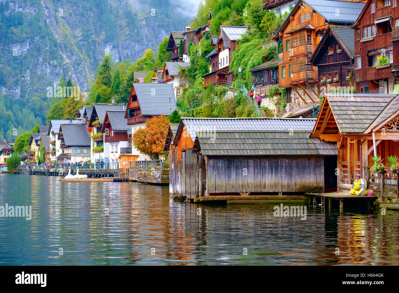 View of traditional old wooden houses up the hill in famous Hallstatt region of Salzkammergut ...