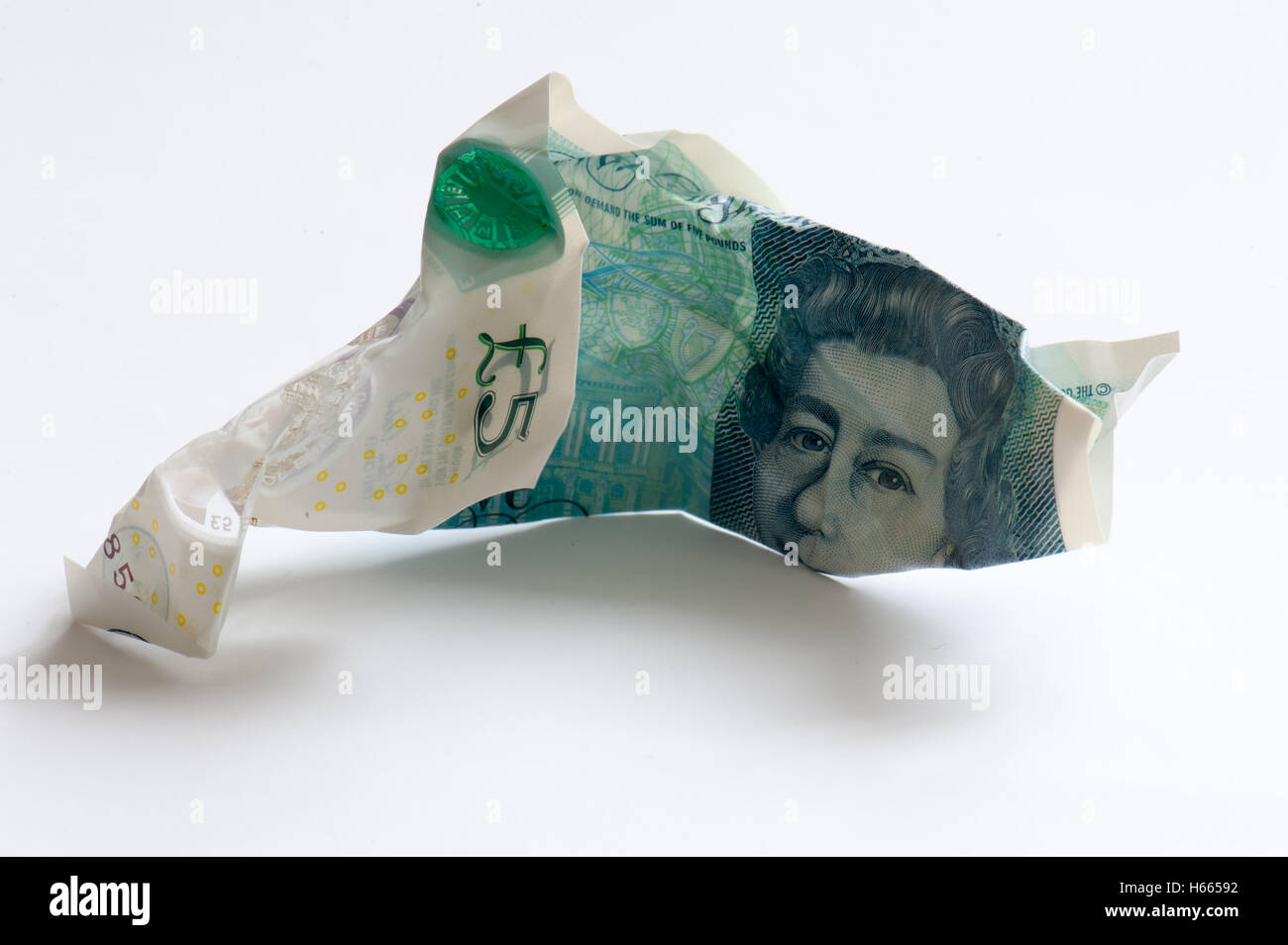 crumpled up new five pound note Stock Photo - Alamy