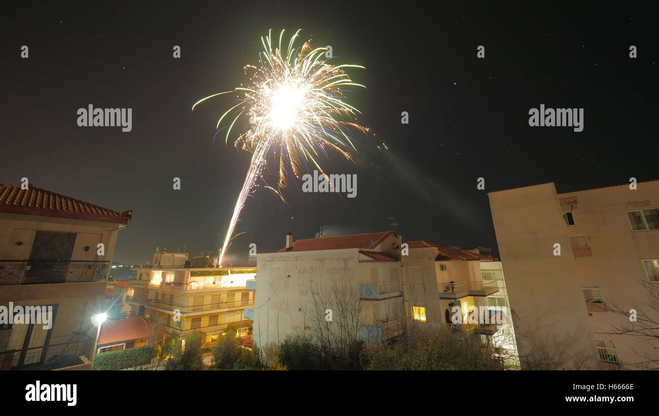 Firework in small town at night Stock Photo - Alamy