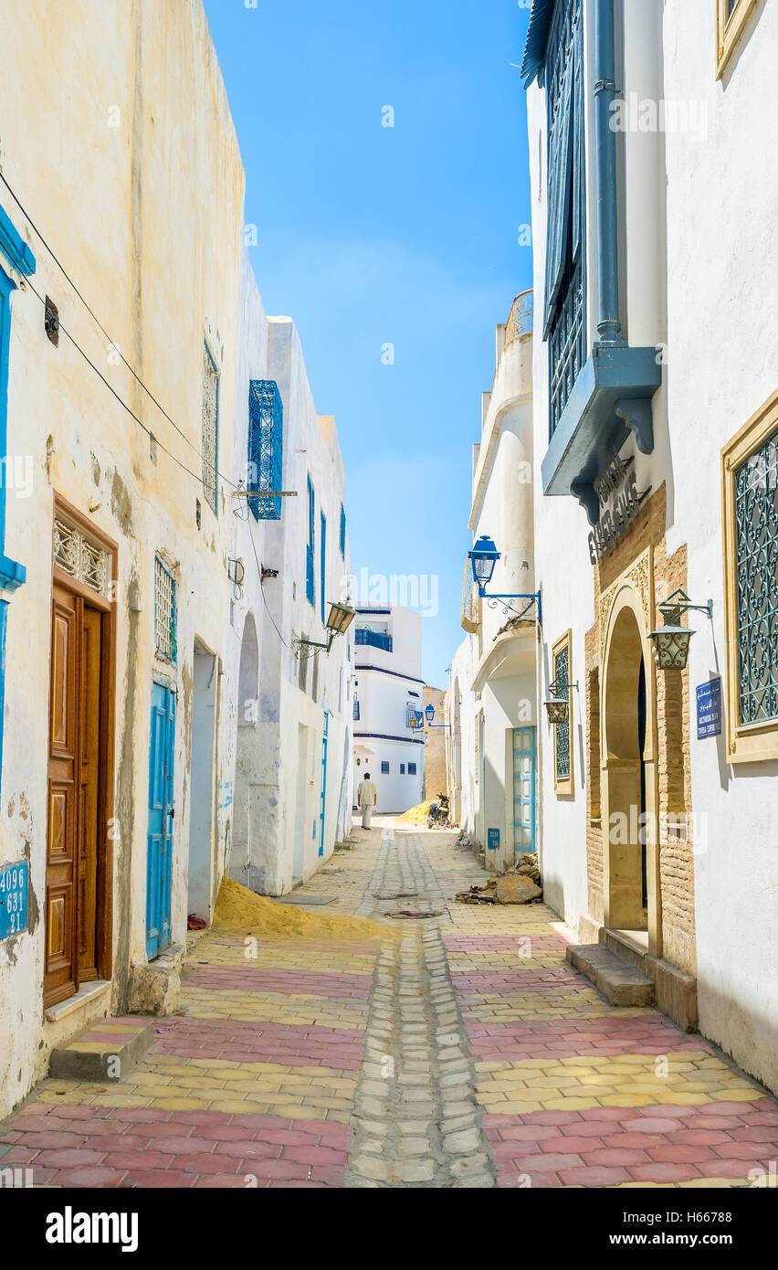 The narrow street of Medina is very clean and all the houses are ...