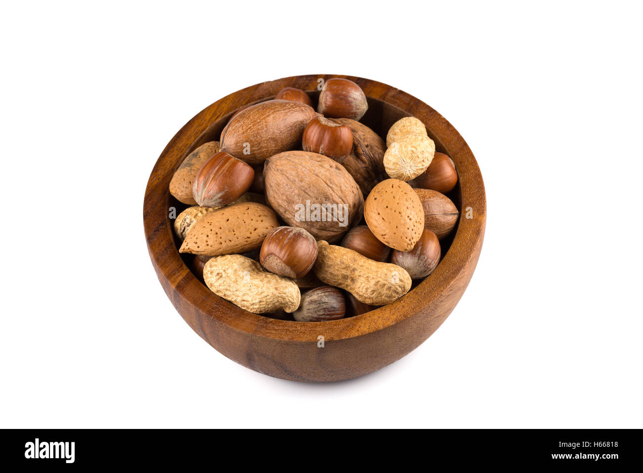 Mixed nuts in shells in a bowl a white background Stock Photo - Alamy